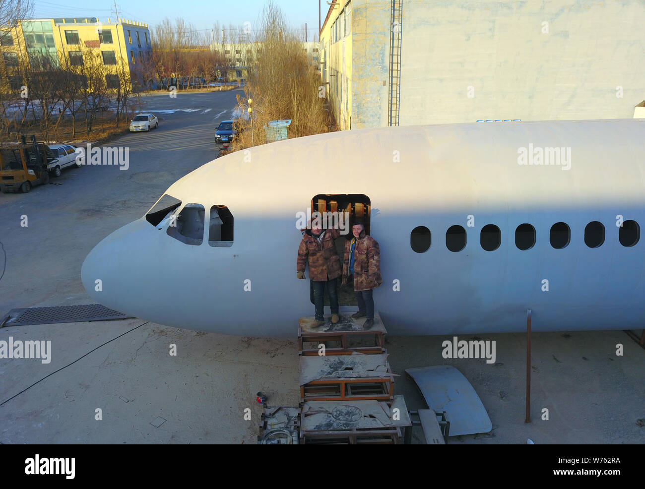 Chinese man Zhu Yue and his team pose in front of their homemade Airbus ...