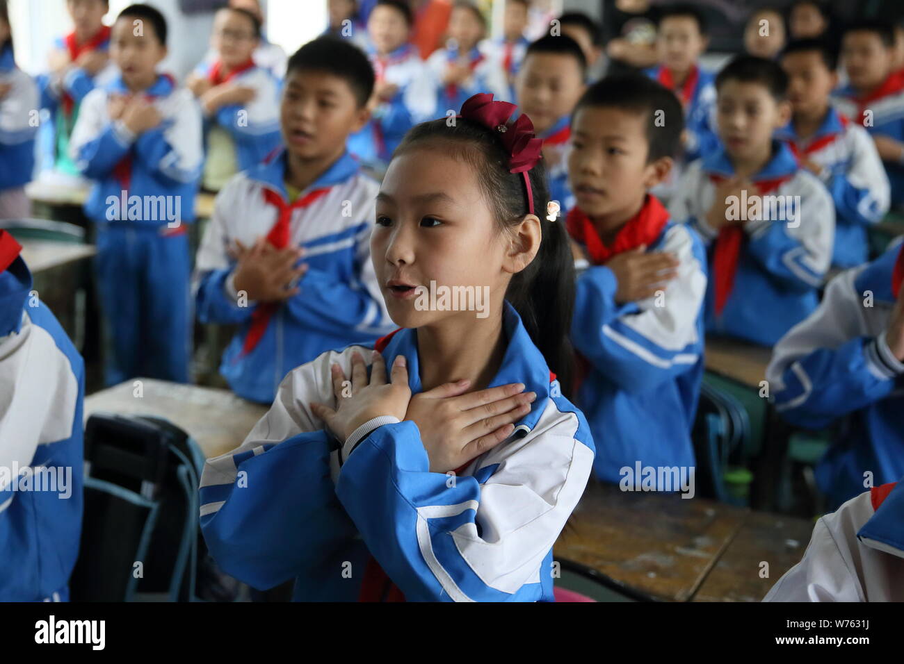 --FILE--Chinese pupils have a music lesson in the classroom at a ...