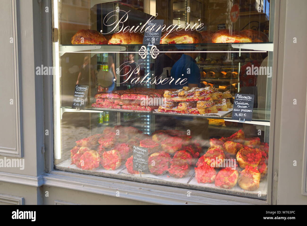 Window display of a baker and patisserie in the old town of the French ...