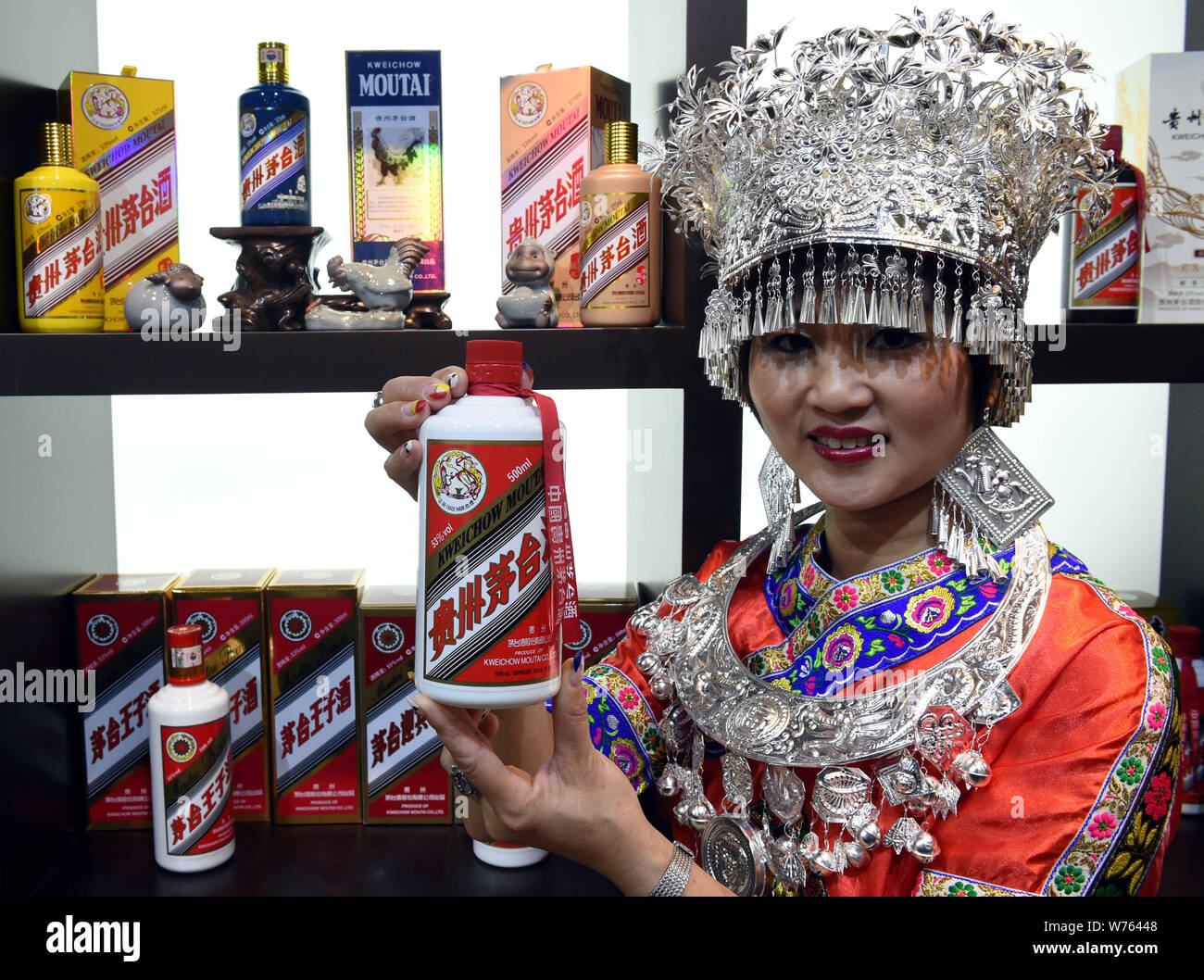 --FILE--A Chinese girl dressed in traditional silver-decorated clothes ...