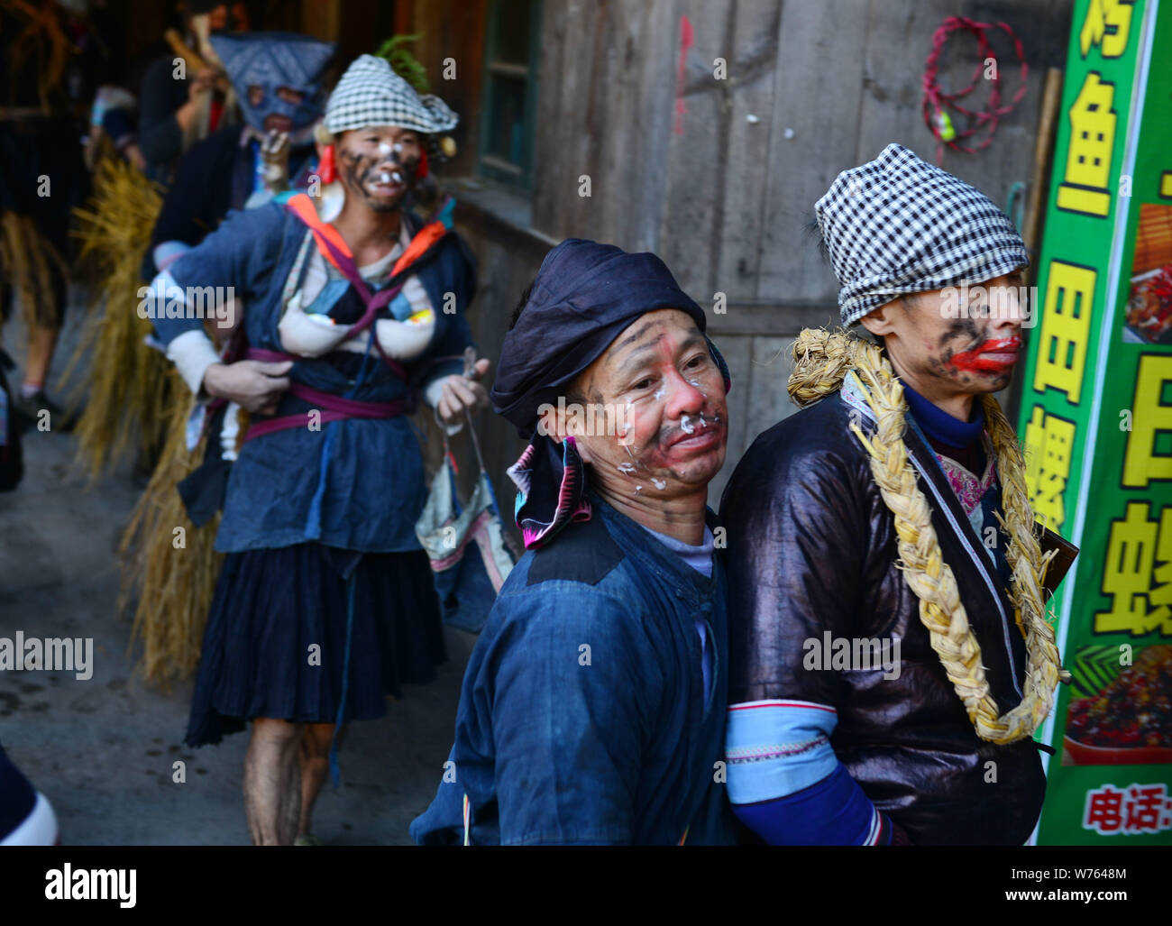 People of Dong ethnic group dressed in traditional costumes attend a ...