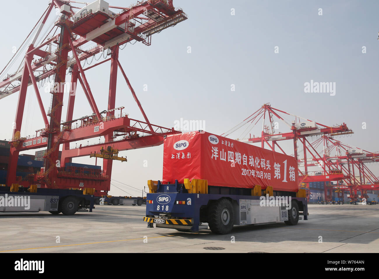 An automated guided vehicle (AGV) of Shanghai International Port Group ...
