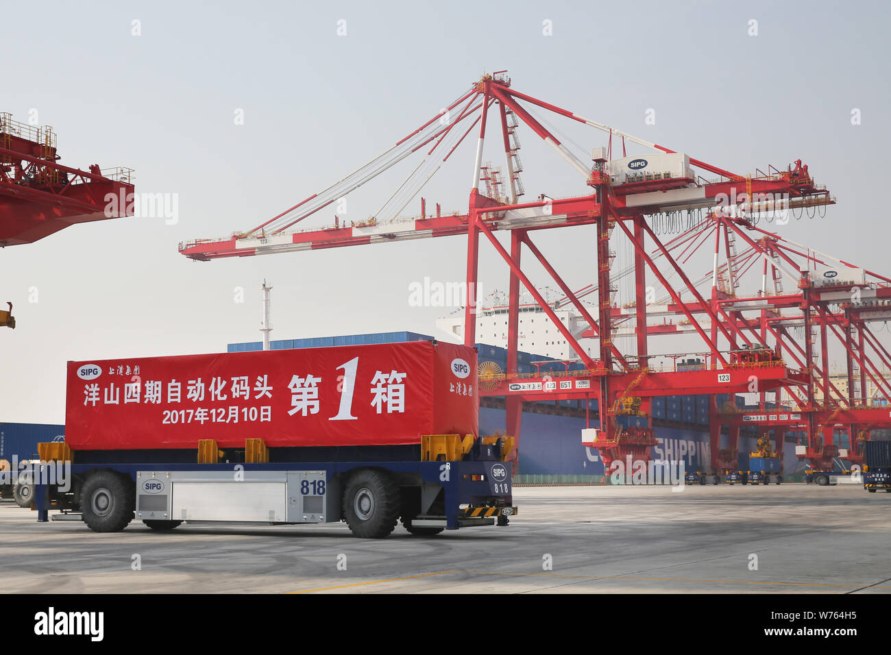 An automated guided vehicle (AGV) of Shanghai International Port Group ...