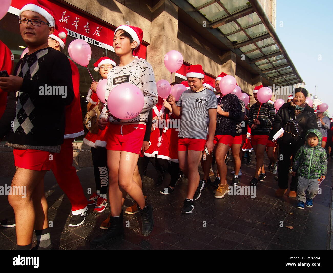 Scantily-clad people parade to celebrate Christmas during a Santa Undie ...