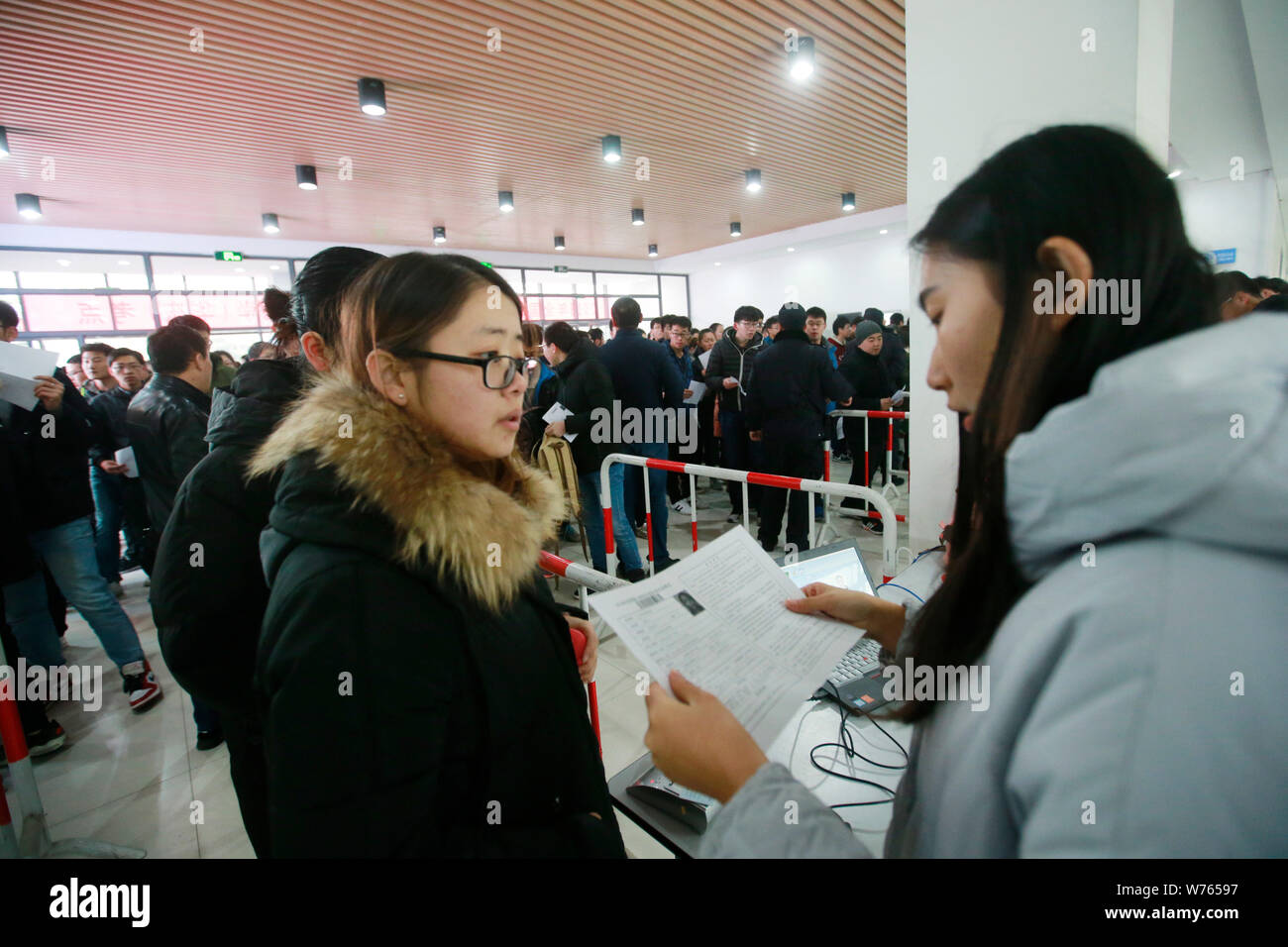 Candidates have their ID checked before participating in the 2018 ...