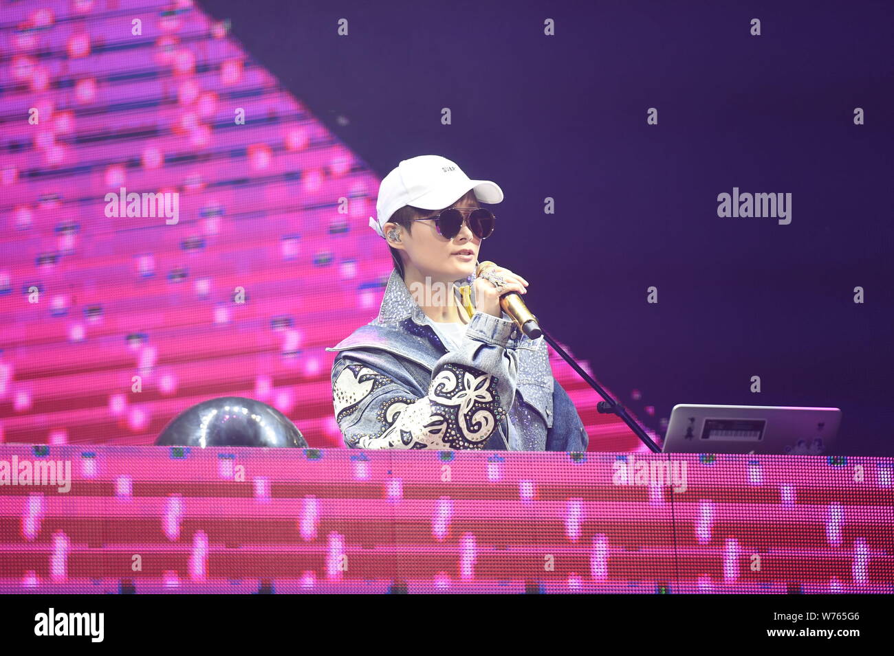 Chinese singer Li Yuchun or Chris Lee performs at a concert to release ...