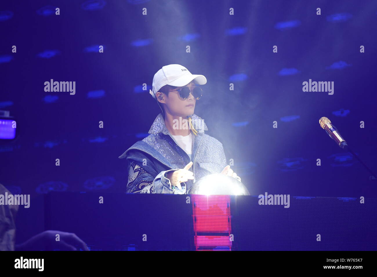 Chinese singer Li Yuchun or Chris Lee performs at a concert to release ...