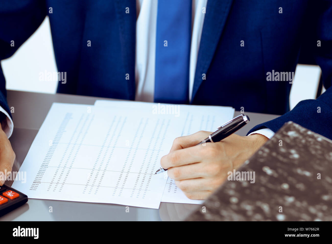 Bookkeeper or financial inspector hands making report, calculating or ...