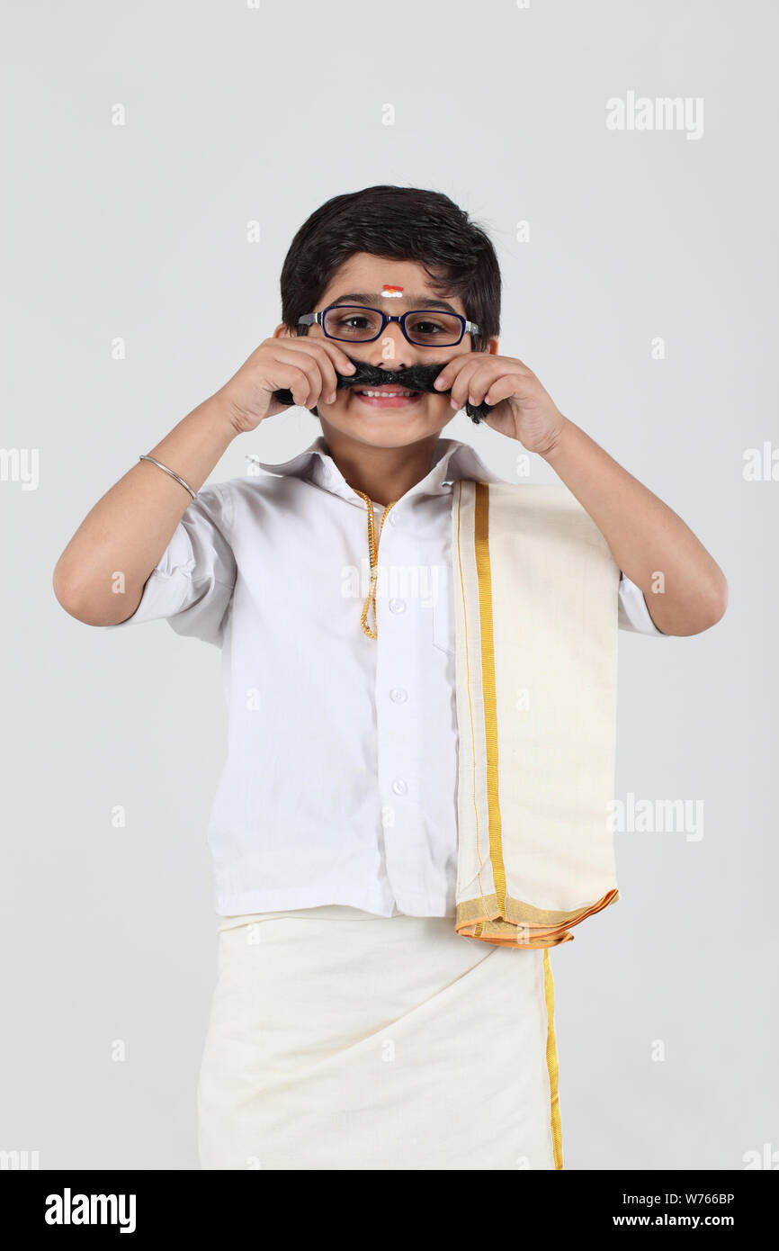 Indian boy making funny face hi-res stock photography and images - Alamy