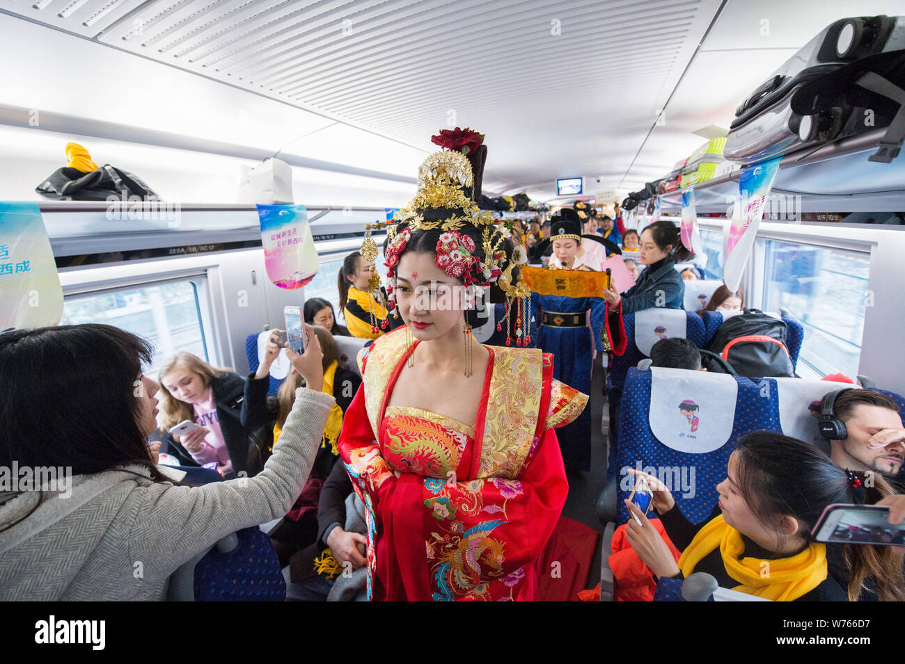 A performer in ancient Chinese costume is pictured in a CRH (China ...