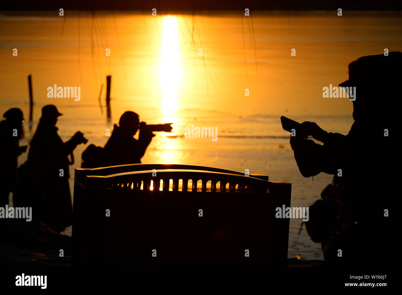 Photographers take photos of the head part of a garbage bin, similar to ...