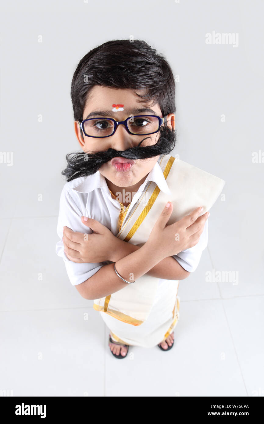 Indian boy pretending to be a south Indian showing mustache Stock Photo ...