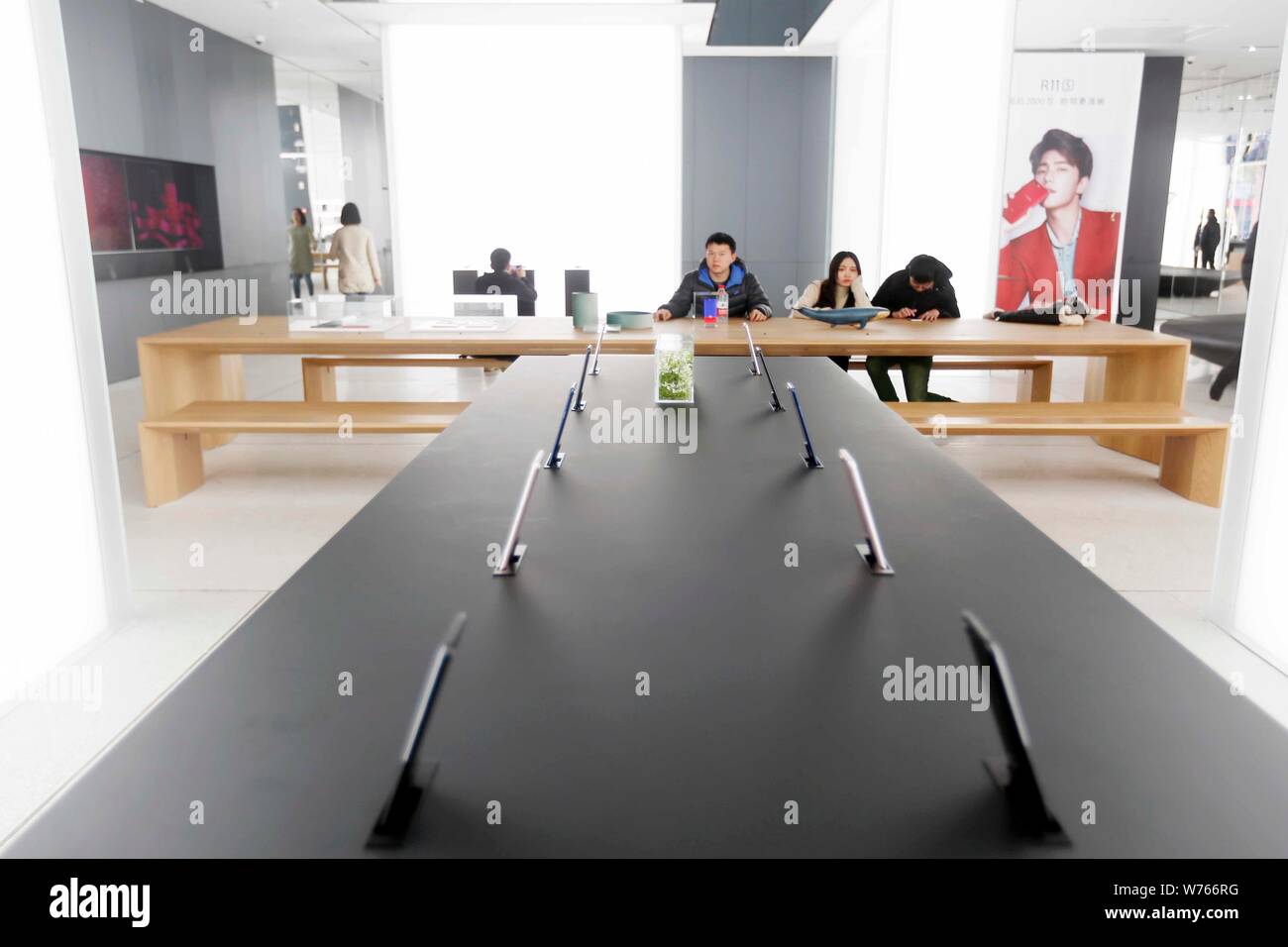 Customers are pictured at OPPO's first super flagship store in Shanghai ...