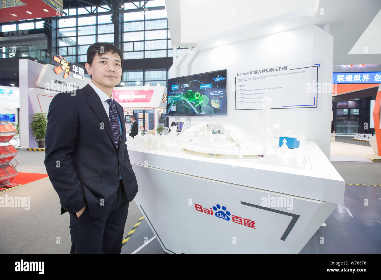 Robin Li Yanhong, Chairman and CEO of Baidu Inc., poses for photos at ...