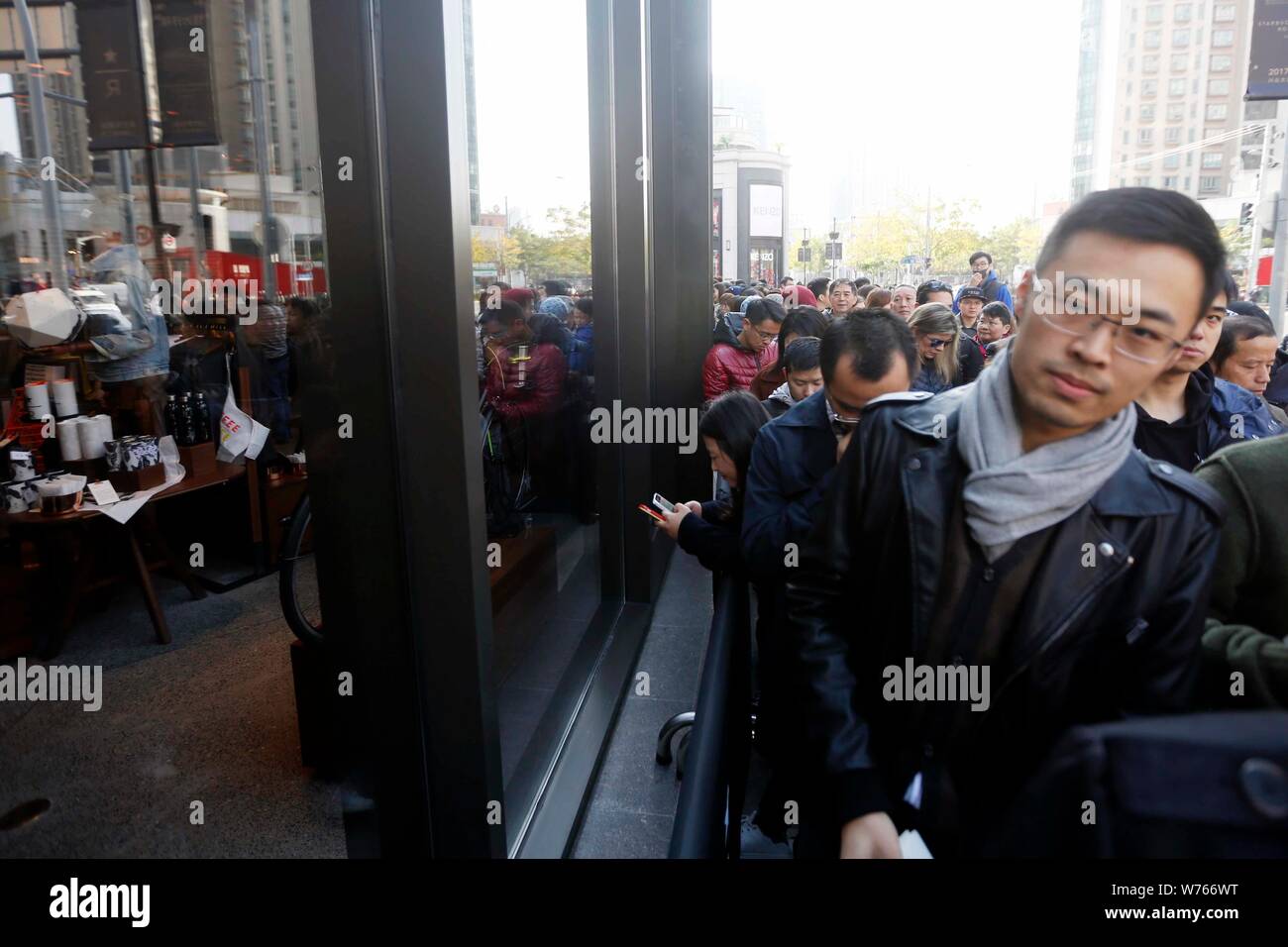 Customers queue up outside the world's largest Starbucks Reserve ...