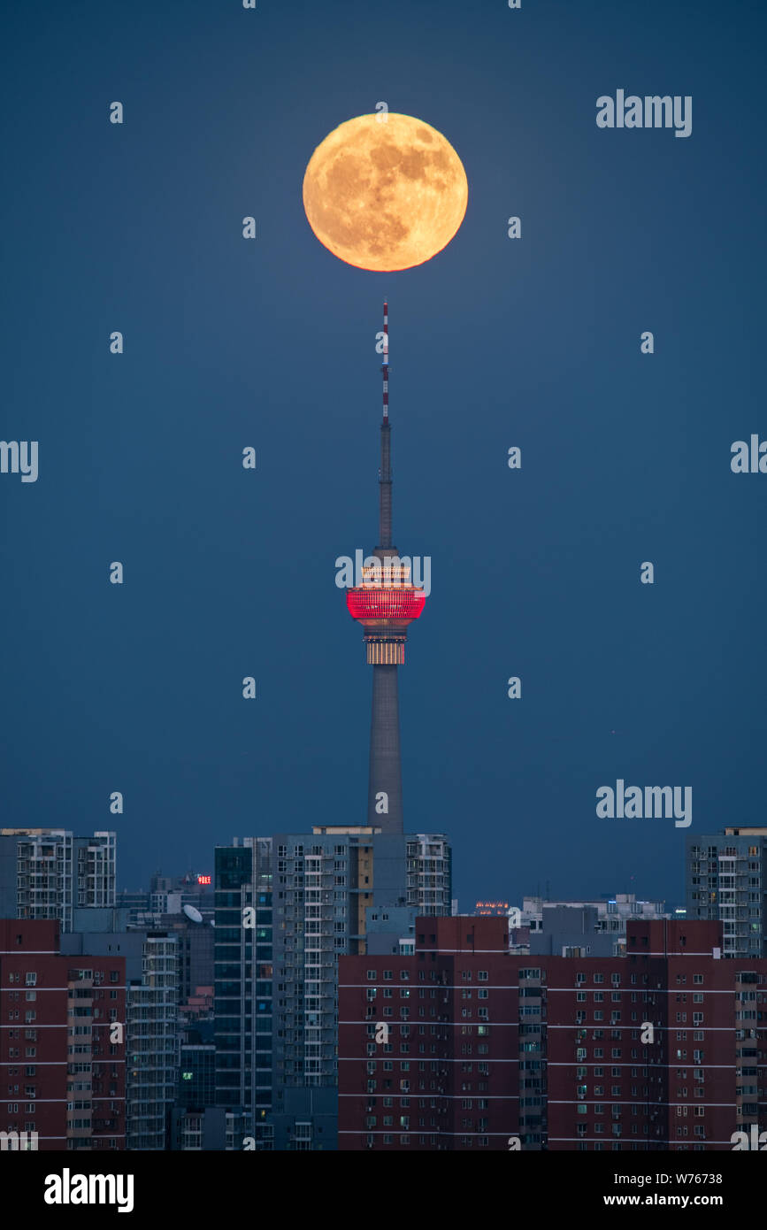 A supermoon is seen in the night sky over Beijing, China, 3 December ...