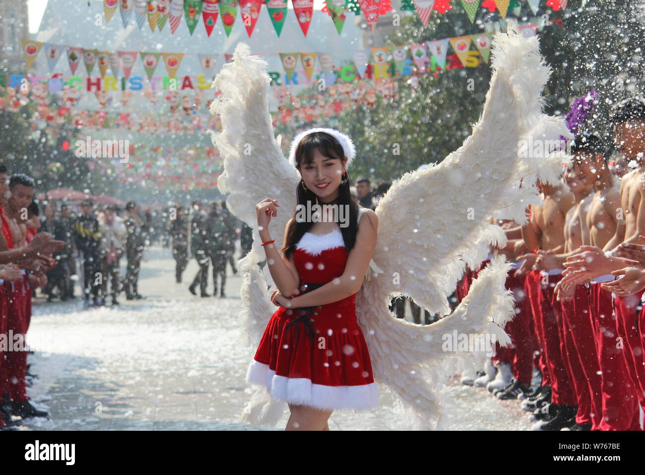 A college student dressed in Santa Claus costume takes part in a ...