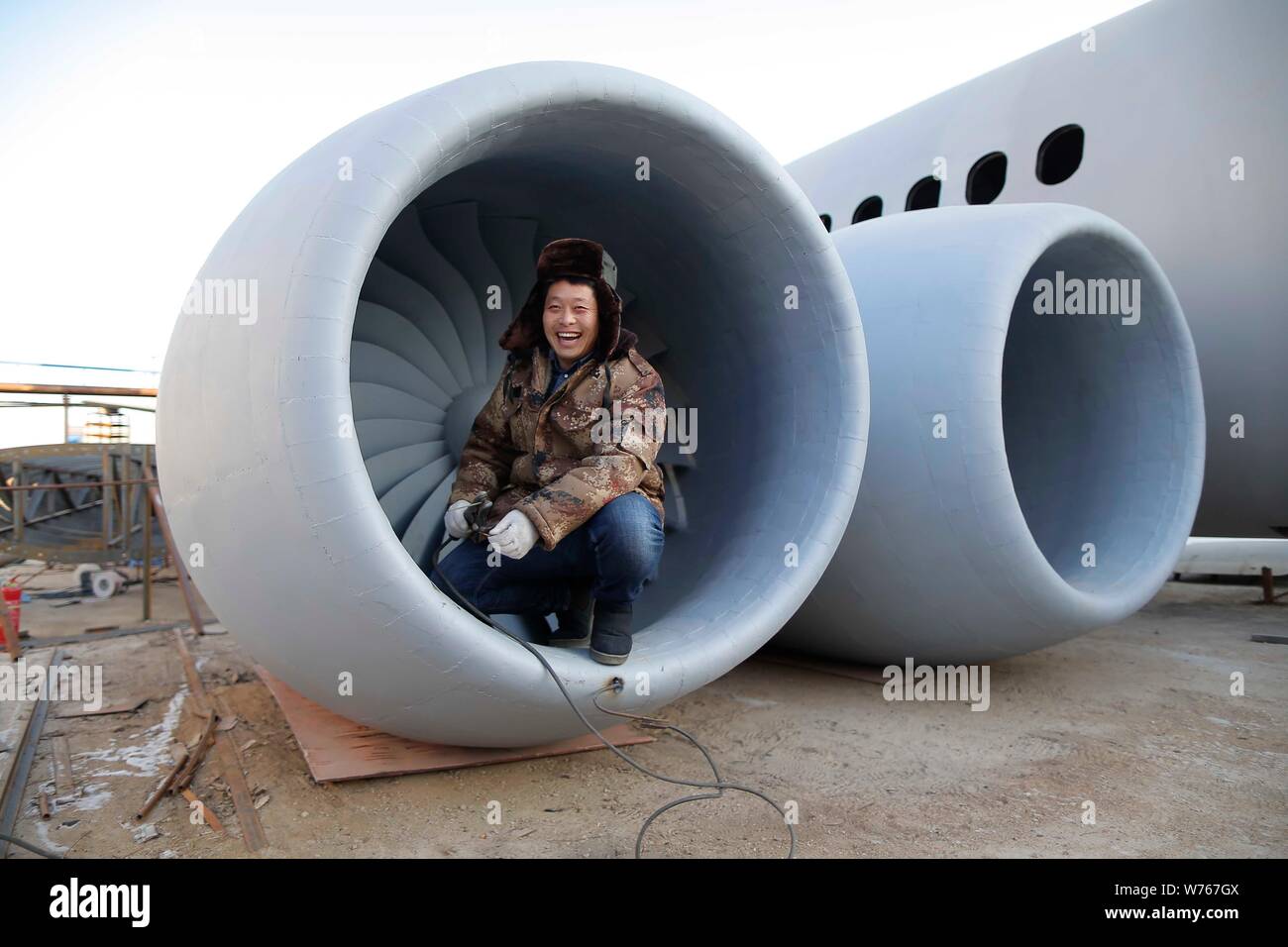 Chinese man Zhu Yue works on a turbine engine of his homemade Airbus ...