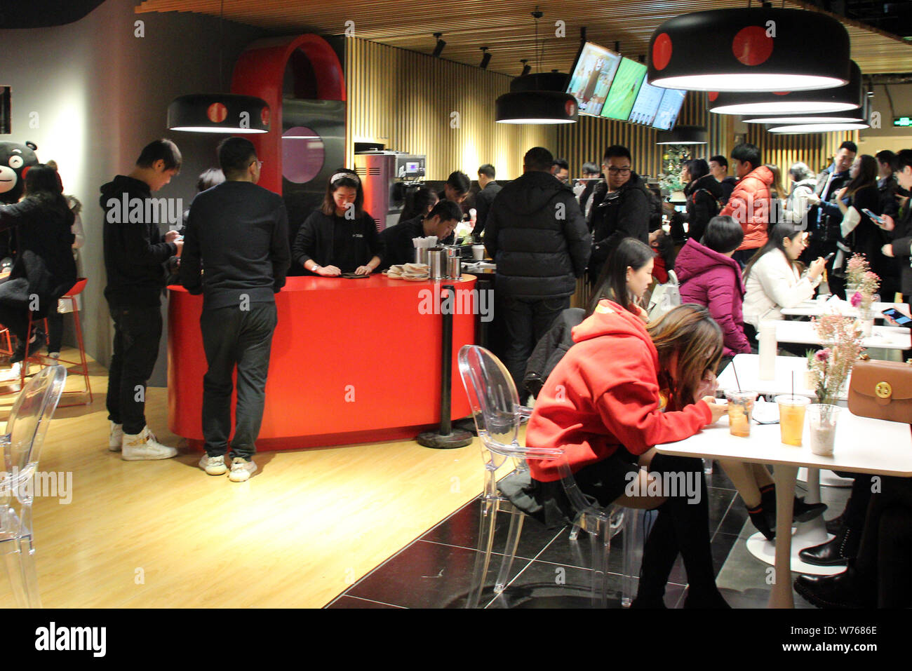 Customers are pictured at the Beijing's largest Kuma Cafe at the ...