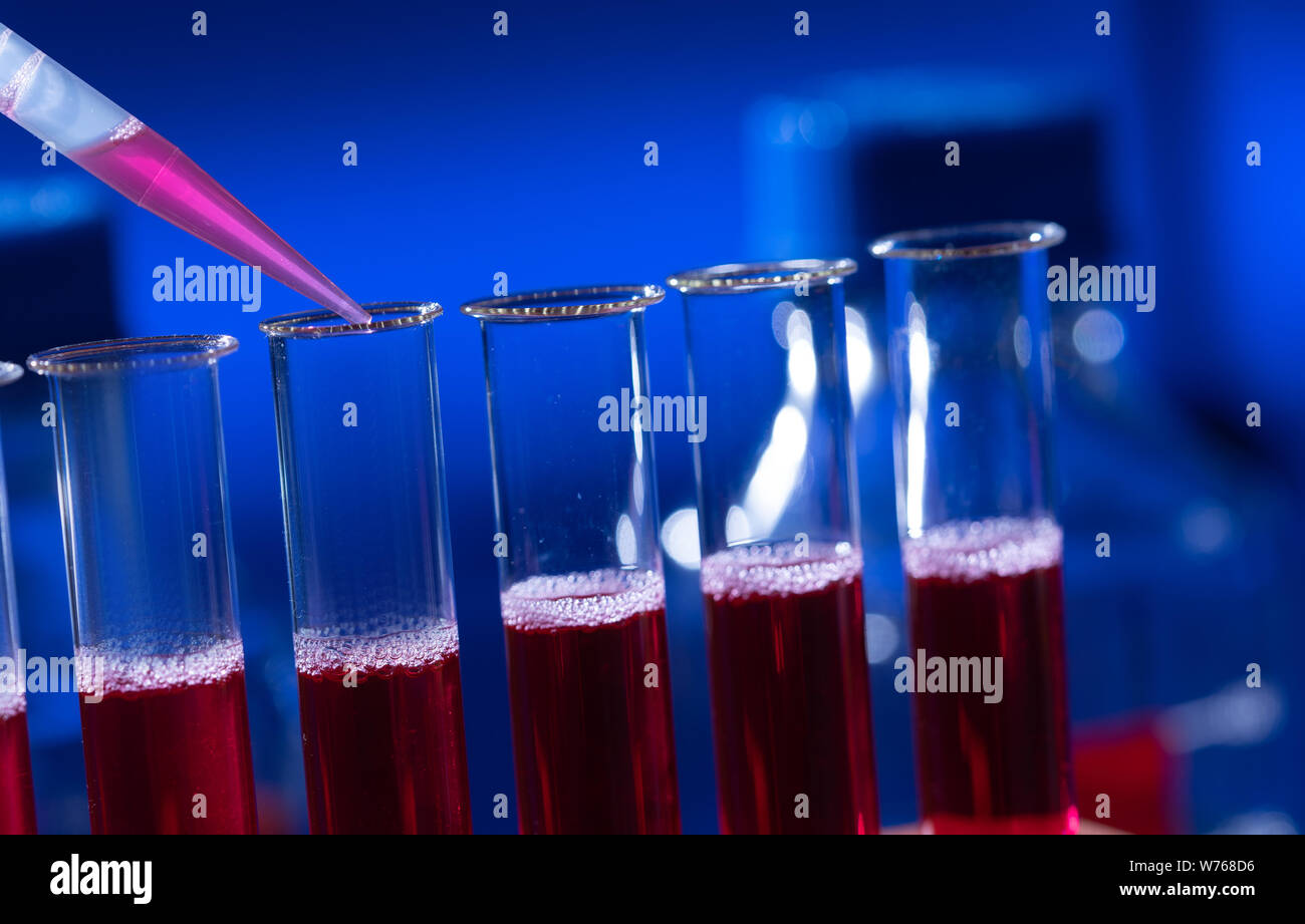 Test tube in rack and pipette media dispenser Stock Photo - Alamy