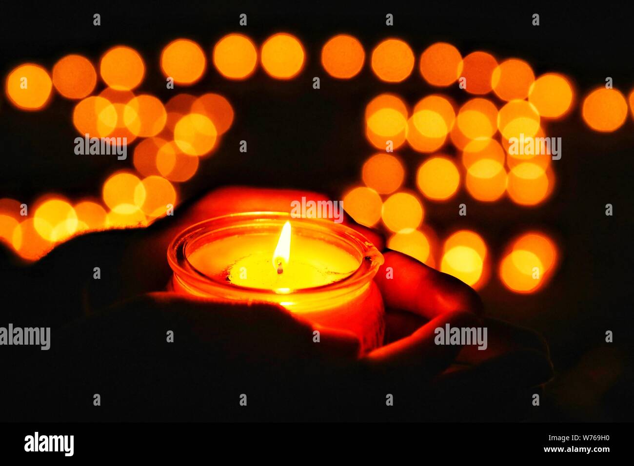 Chinese students hold candles during a candlelight vigil to mourn the ...