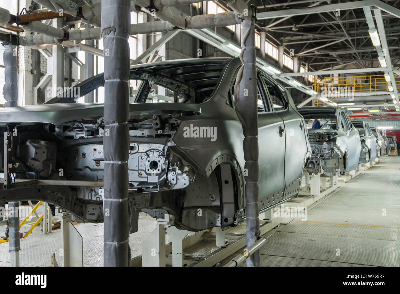 The series consists of metal bodies of cars at the automobile plant ...