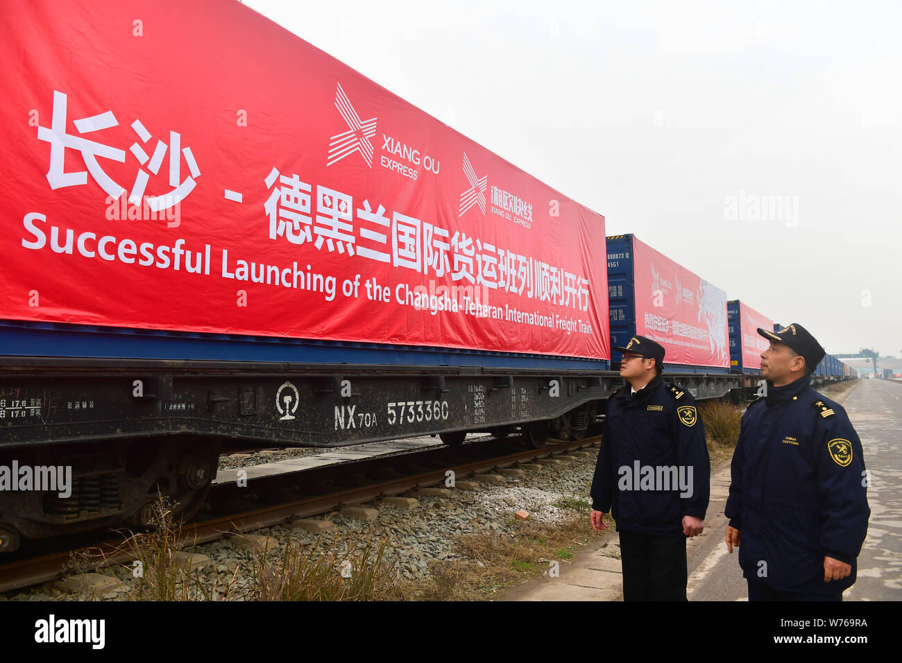 Chinese customs officers check a freight train of China Railway Express ...