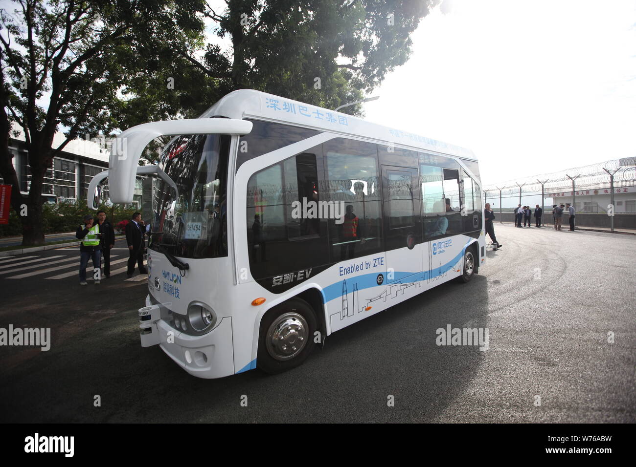 A self-driving bus drives on a road during its trial operation in ...