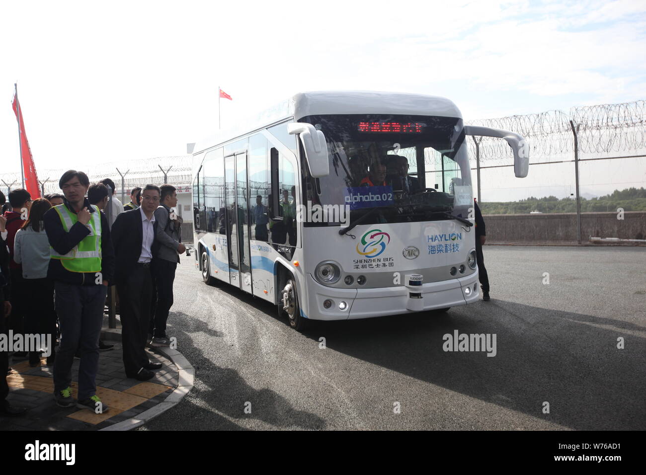 A self-driving bus drives on a road during its trial operation in ...