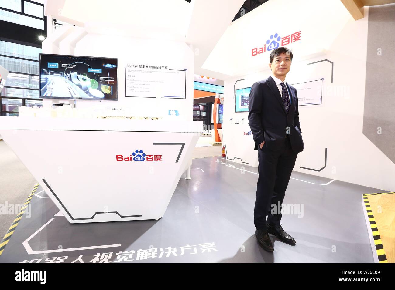 Robin Li Yanhong, Chairman and CEO of Baidu Inc., poses for photos at ...