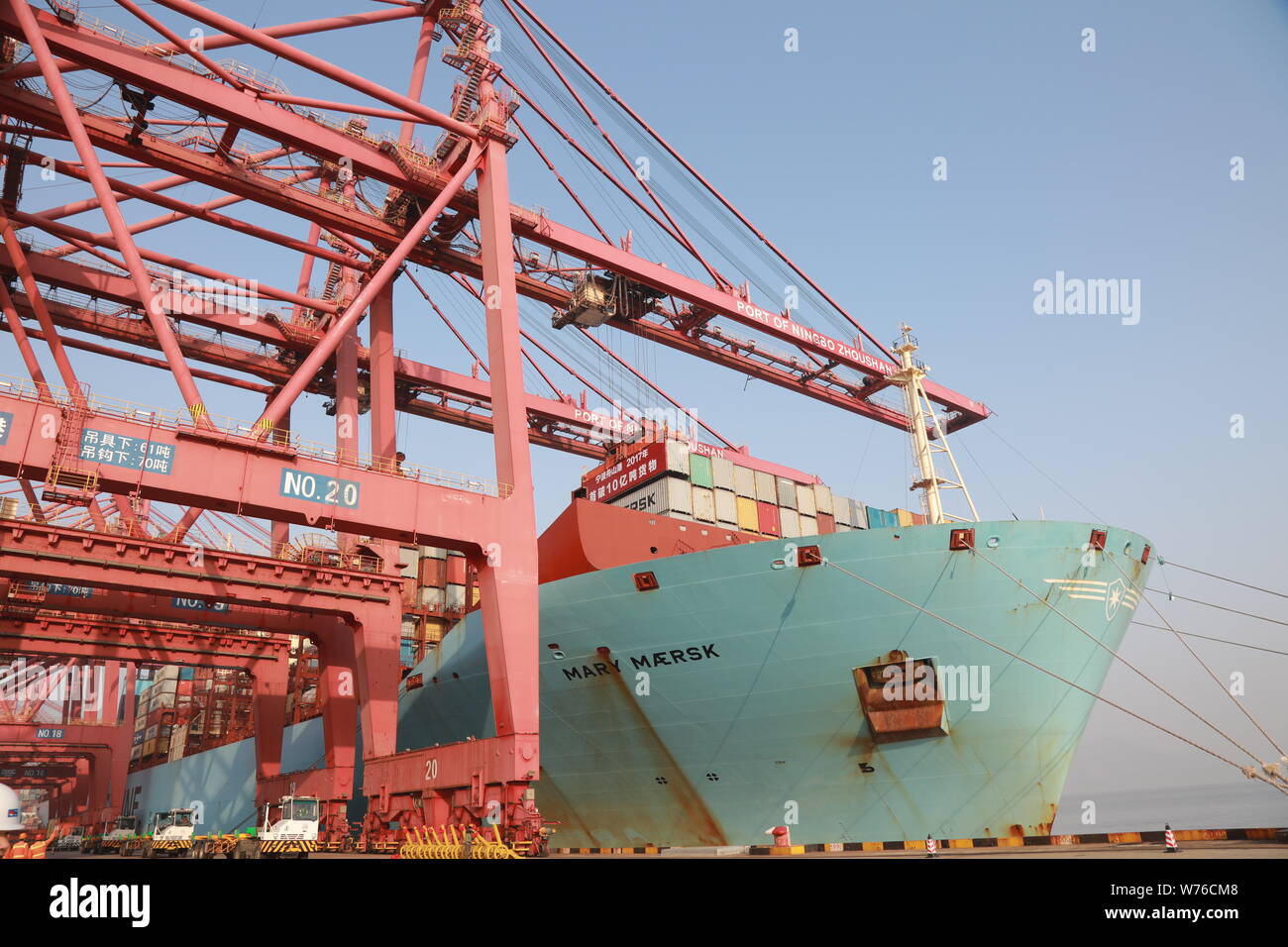 A Mary Maersk container ship berths with containers to be shipped ...