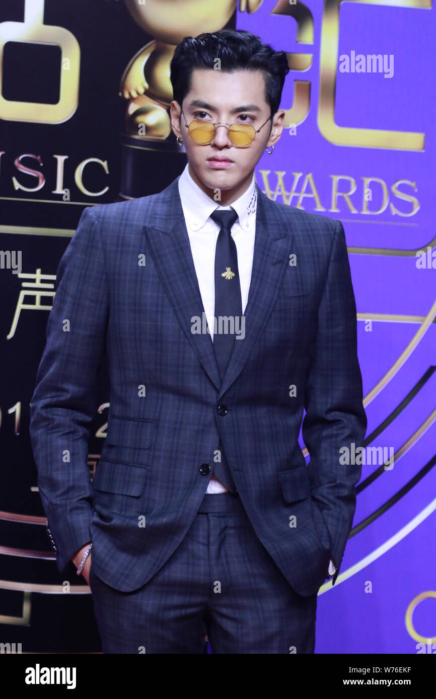 Chinese singer and actor Kris Wu or Wu Yifan poses as he arrives on the ...