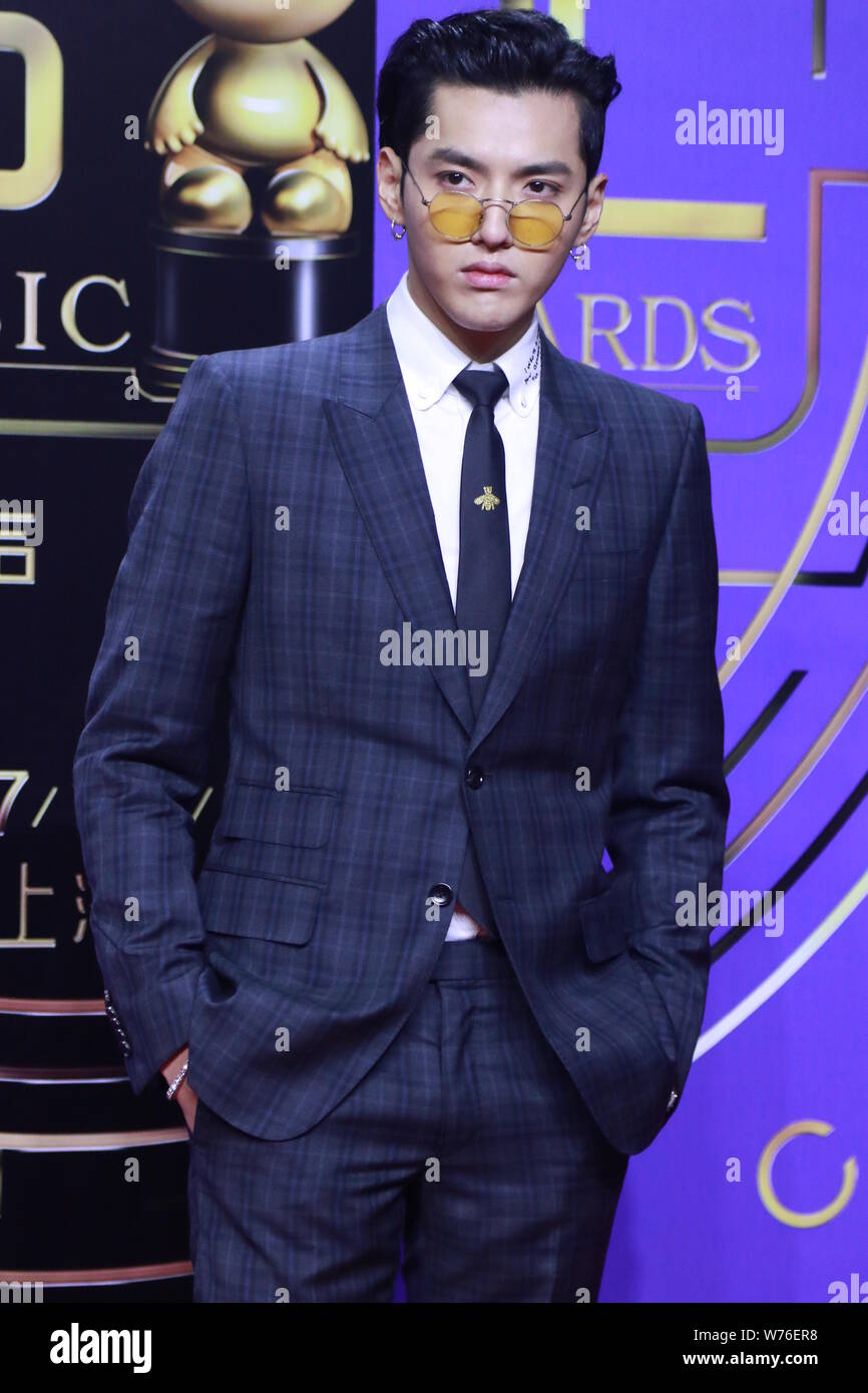 Chinese singer and actor Kris Wu or Wu Yifan poses as he arrives on the ...