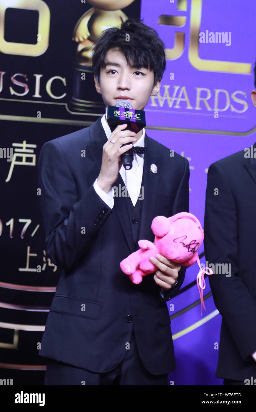 Karry Wang or Wang Junkai of Chinese boy group TFBoys poses as he arrives on the red carpet for ...