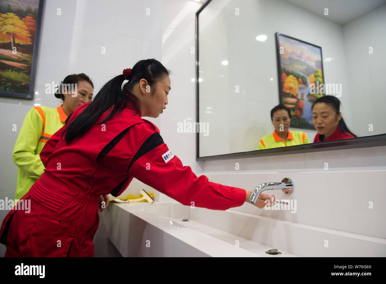 Japanese cleaning worker Haruko Niitsu, front, teaches a Chinese ...