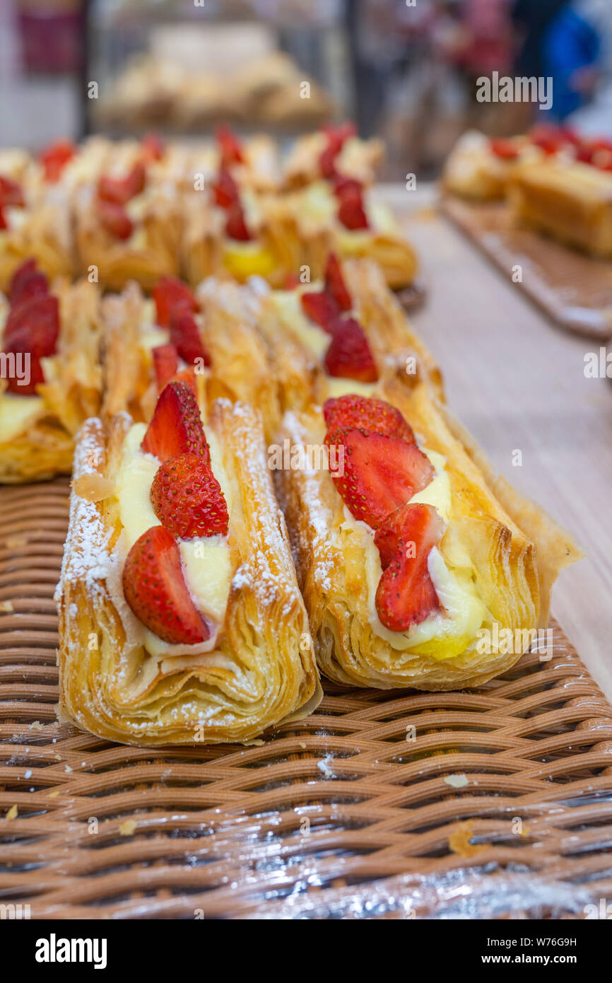 Fresh puff pastry with sweet strawberry on tray at patisserie Stock ...