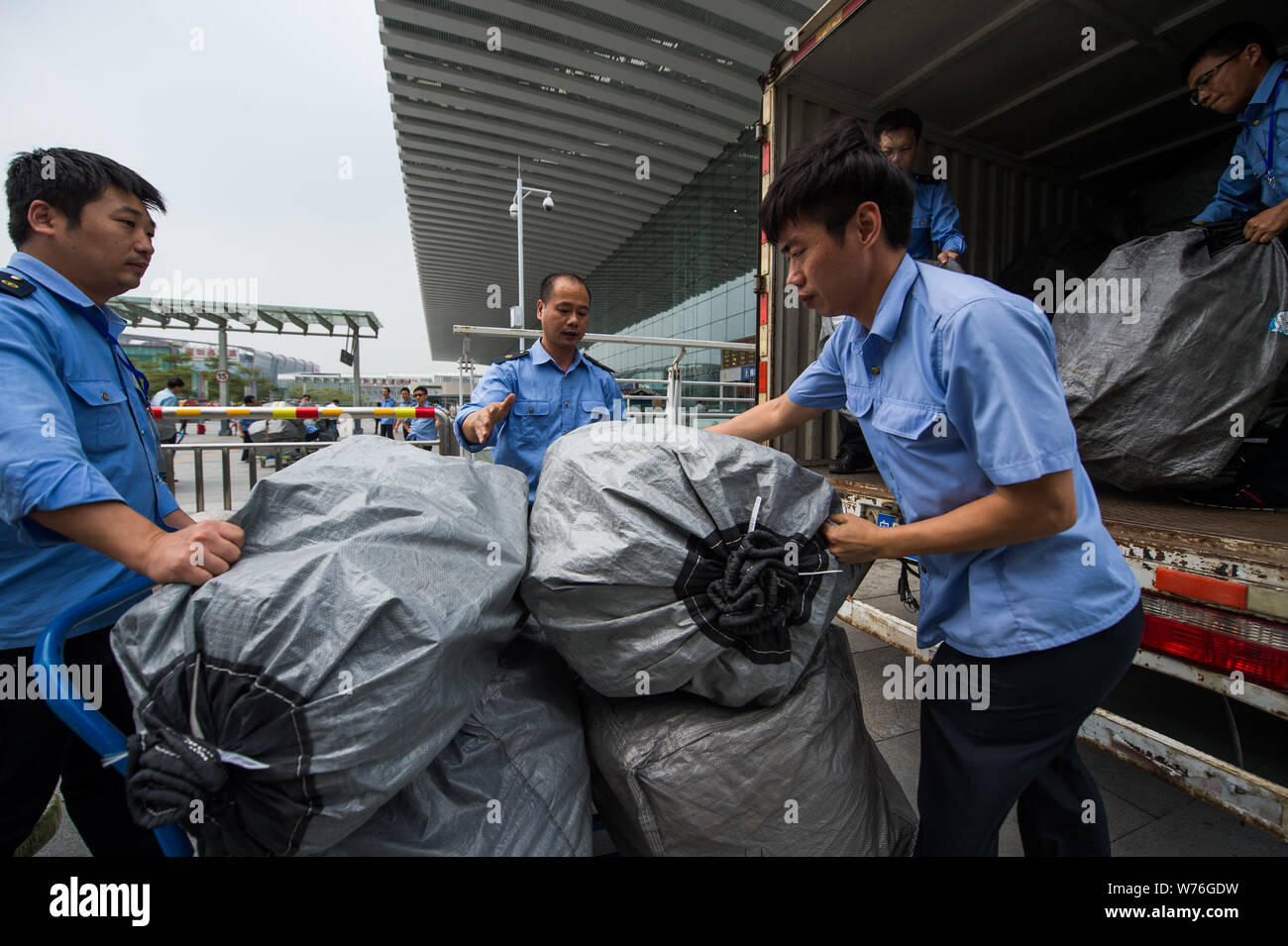 Chinese employees of China Railway Express (CRE) move massive number of ...