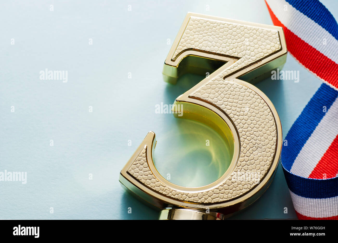 3rd place runner up gold numeric trophy for award in a championship or ...