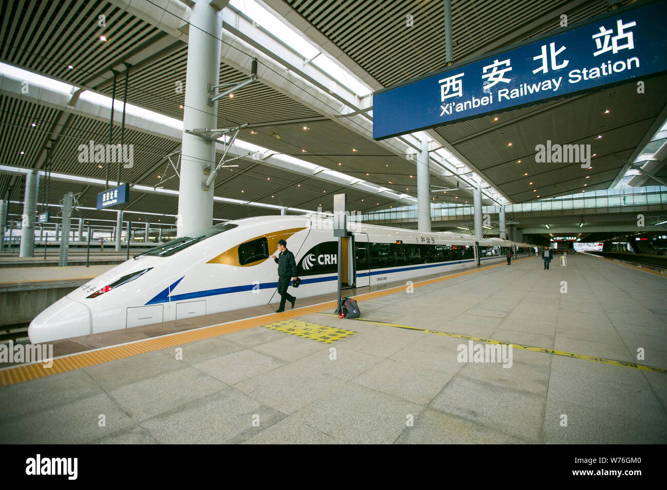 A Chinese staff checks a high speed bullet train on Xi'an¨CChengdu high ...