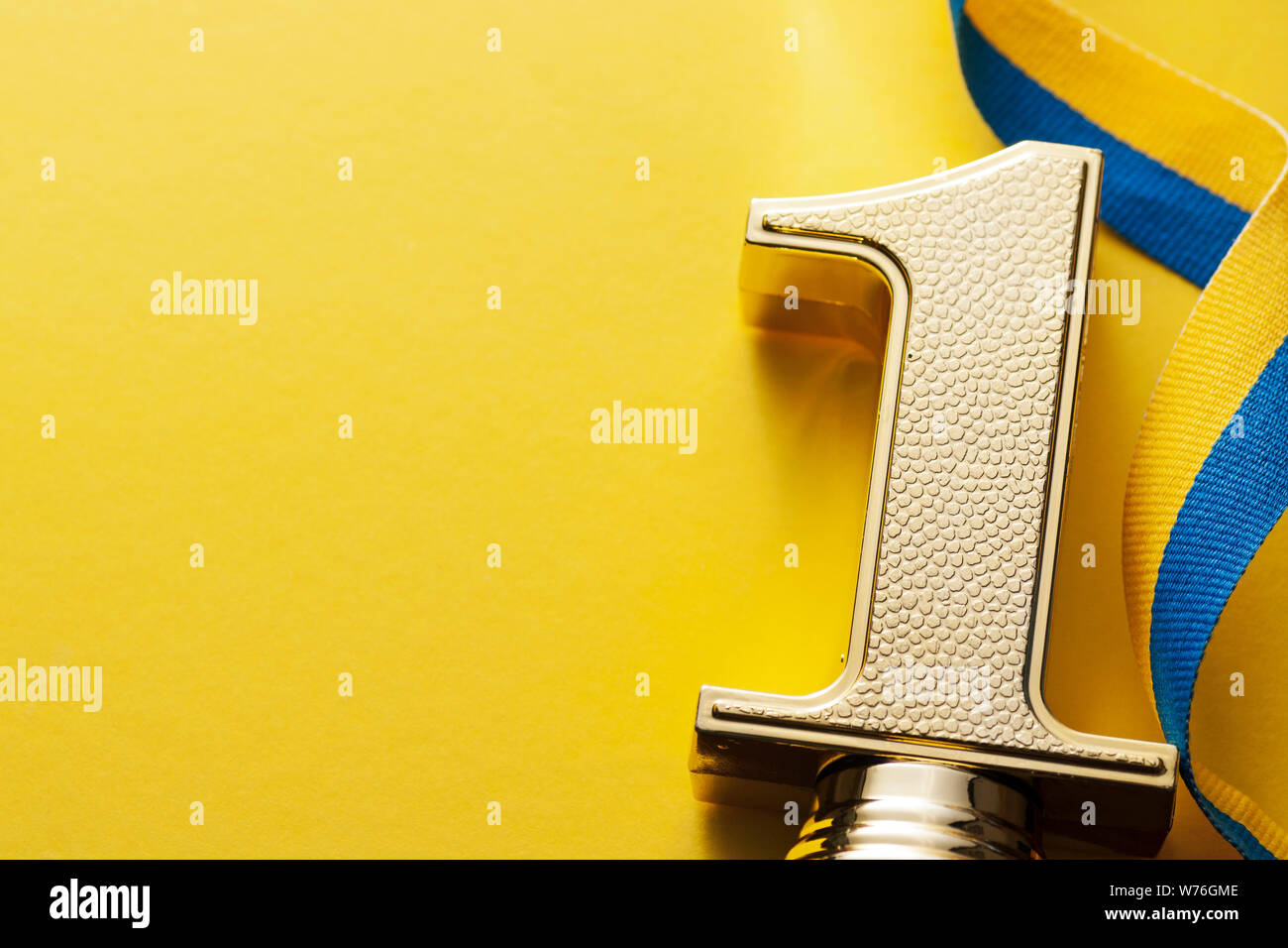 Number one gold winners trophy for a competition or championship with a ...