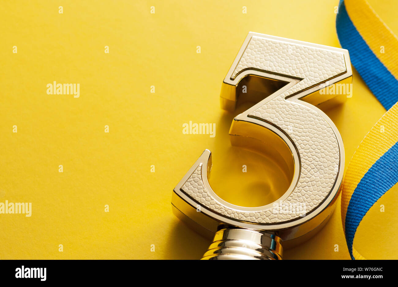 Number three 3rd place runner up gold trophy award for a competition ...