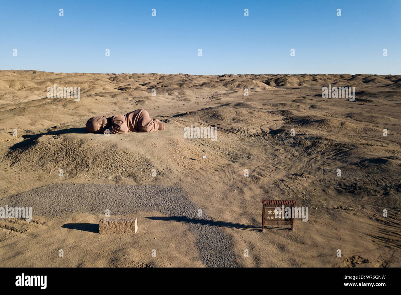 Aerial view of a giant 3D sleeping baby sculpture on display on the ...