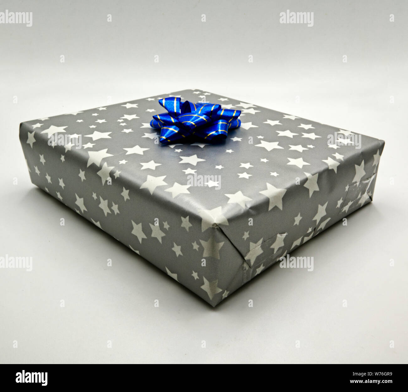 Silver gift box with blue ribon isolated on white background Stock ...