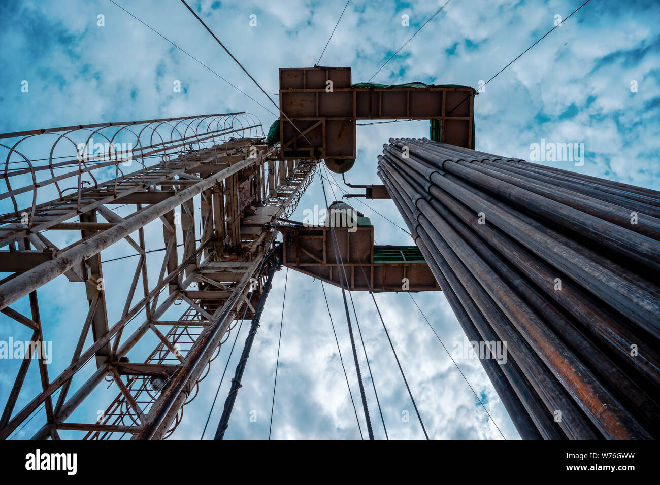 Oil and Gas Drilling Rig onshore dessert with dramatic cloudscape. Oil ...