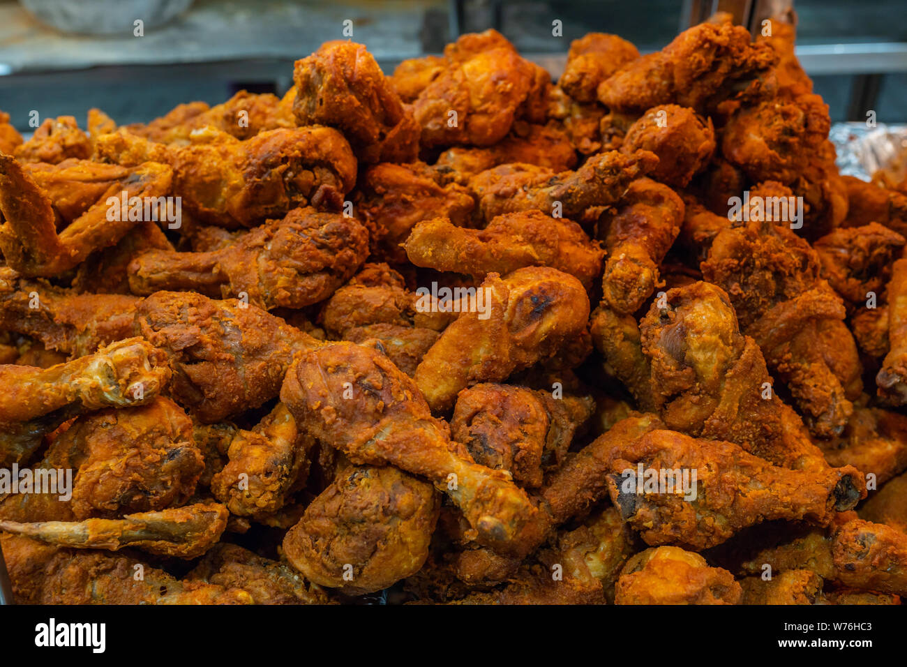 Huge pile of tasty chicken drumsticks fried with batter Stock Photo - Alamy