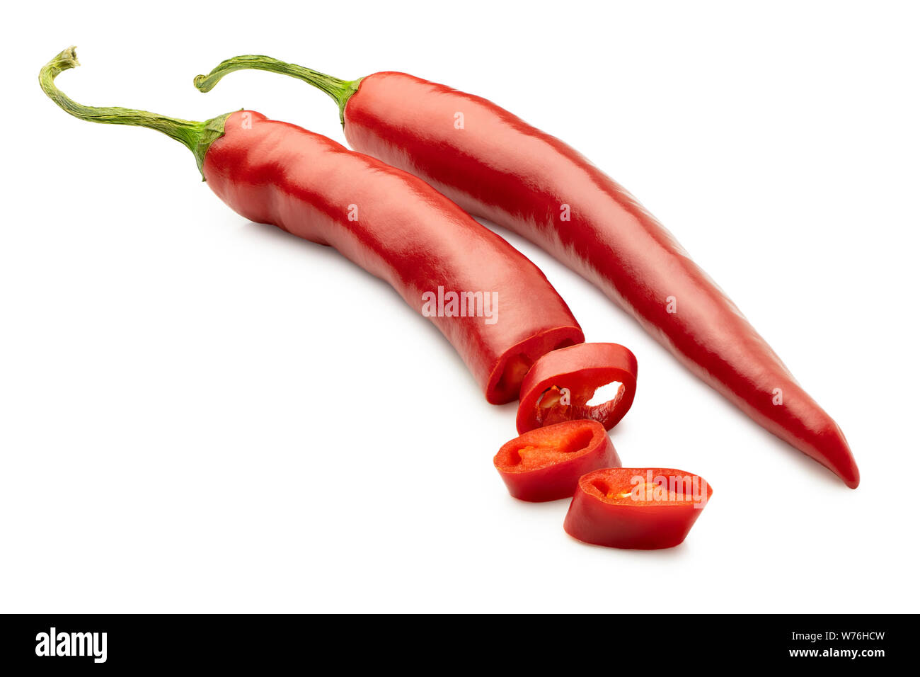One whole and one cut red chilli isolated on white Stock Photo - Alamy