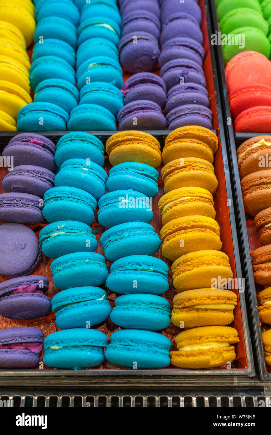 Vertical photo of sweet and colorful macarons cake at patisserie Stock ...