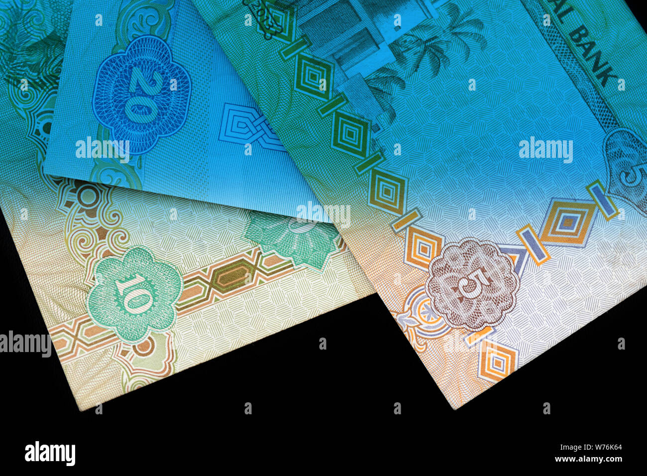 UAE dirham currency notes close up. Money background blue color toned ...