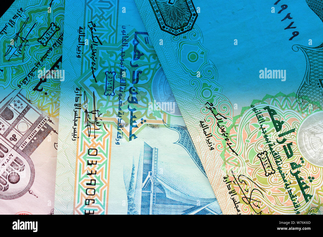UAE dirham currency notes close up. Money background blue color toned ...