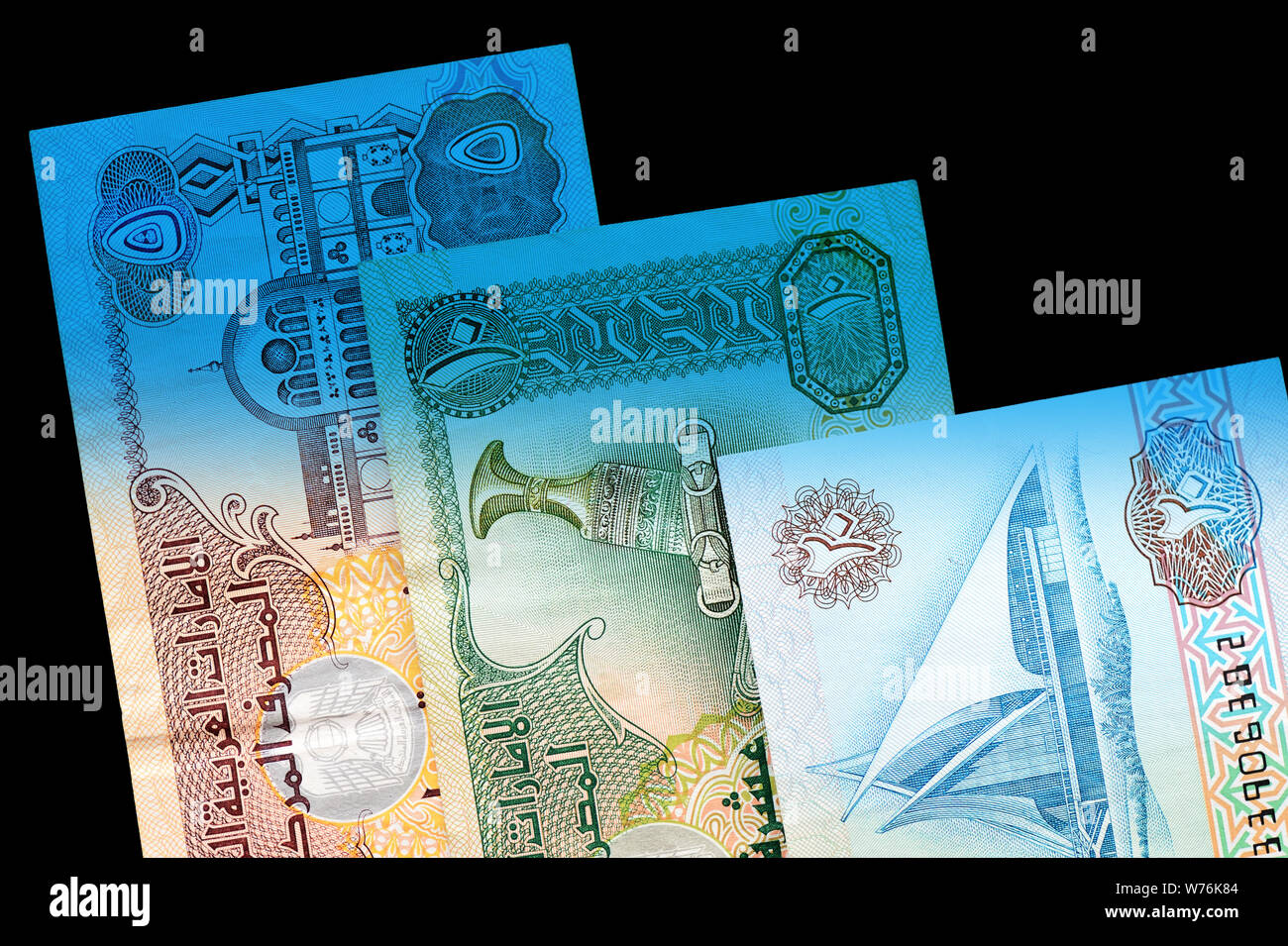 UAE dirham currency notes close up. Money background blue color toned ...